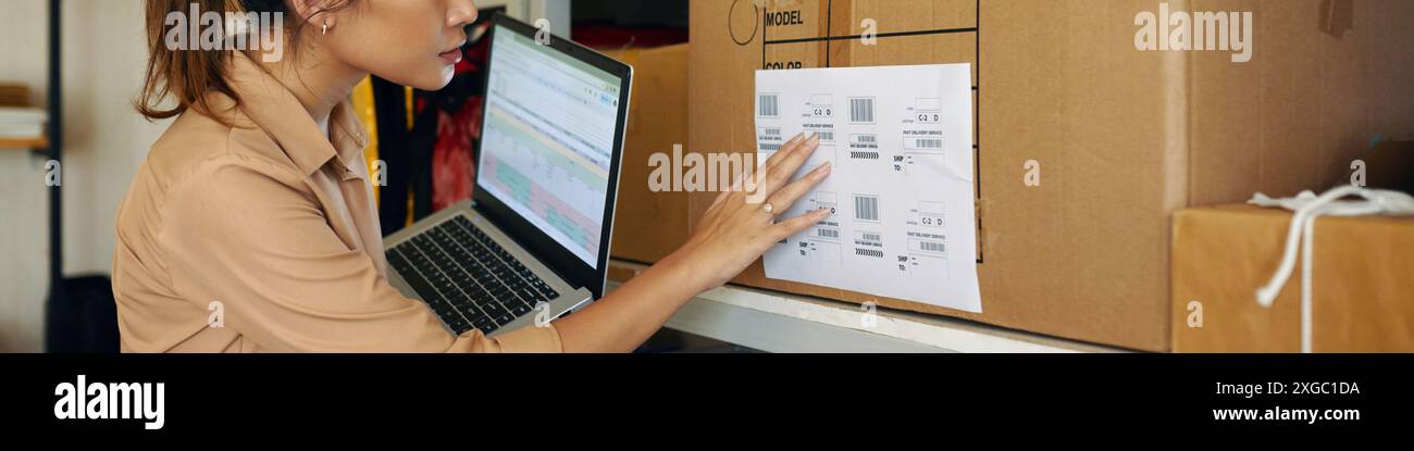 Woman Checking Data On Barcodes Of Parcels Stock Photo - Alamy