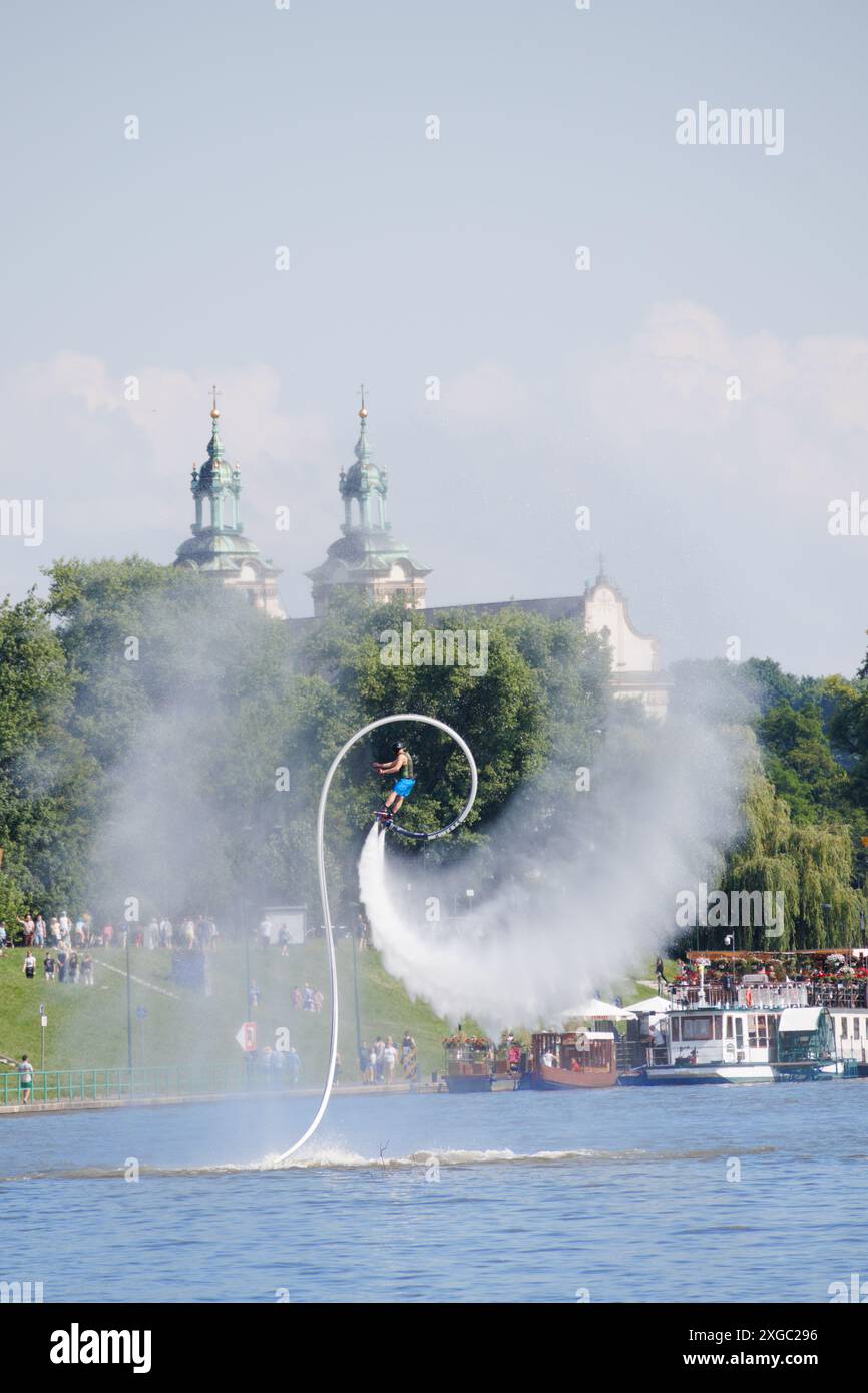 Hydroflight athlete performing acrobatic tricks over the river on a ...