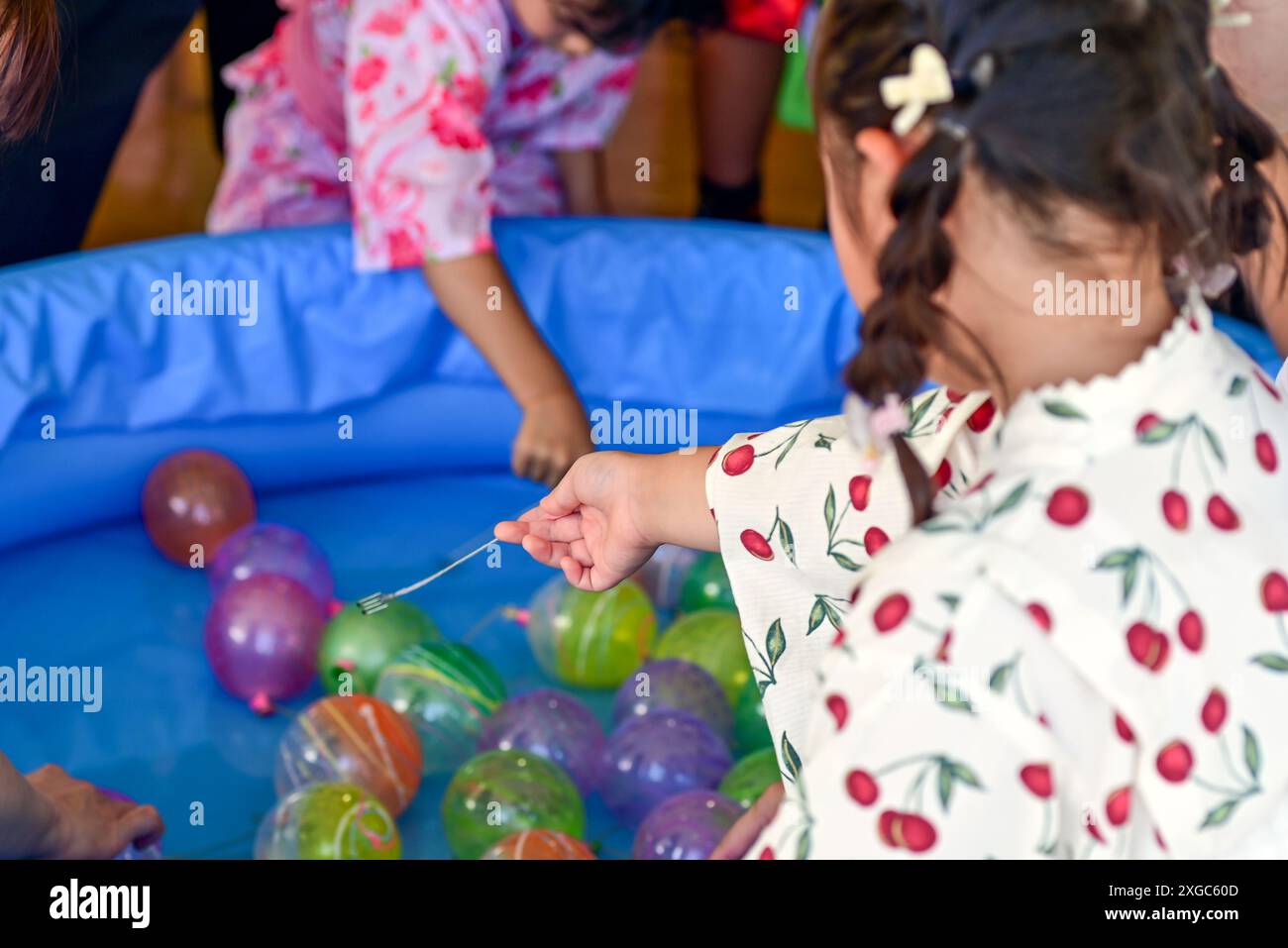 Yo-yo fishing - a Japanese summer festival game for kids also known as ...