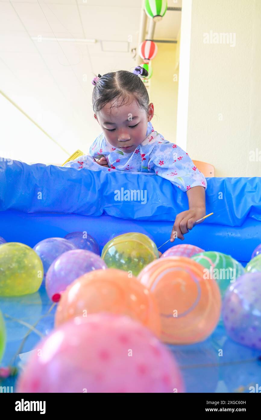 Yo-yo fishing - a Japanese summer festival game for kids also known as ...