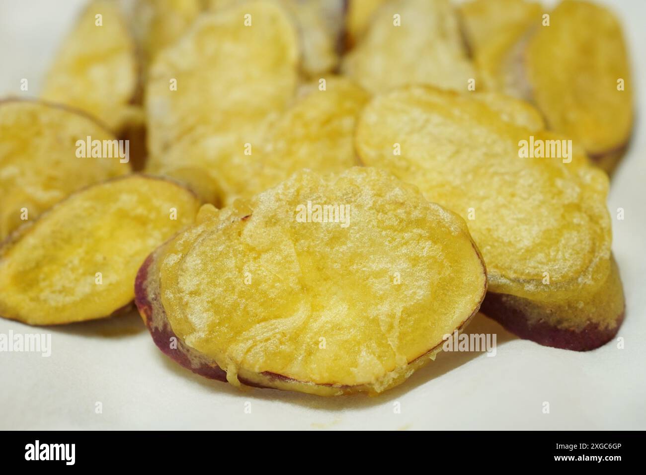 Satsumaimo no tempura, Japanese dish of sweet potatoes dipped in ...