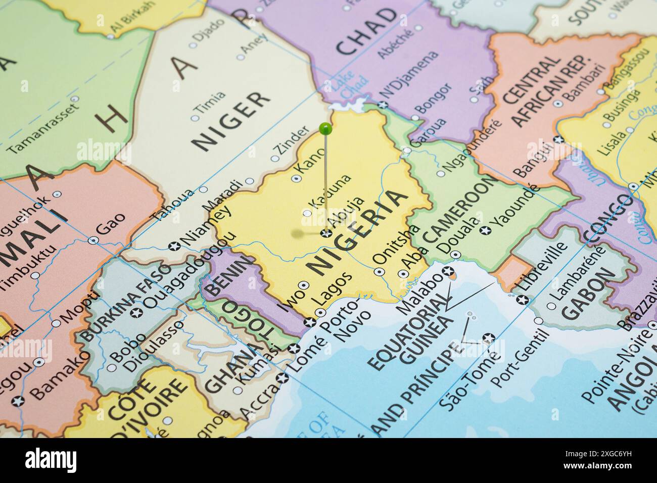 Close up to a Abuja city with a green pin needle into Nigeria country ...