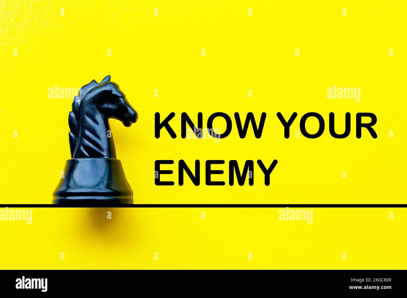 Know your enemy text on yellow cover with black knight chess background ...