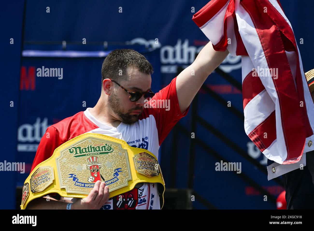 Professional competitive eater Patrick Bertoletti consumes 58 hot dogs ...