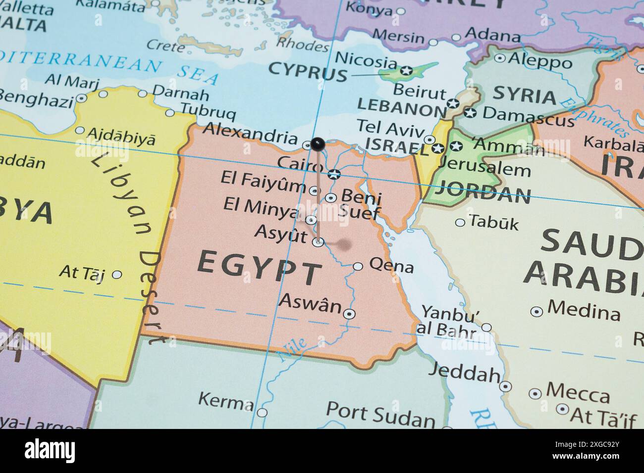 Close up to a Asyut city with a black pin needle into Egypt country ...