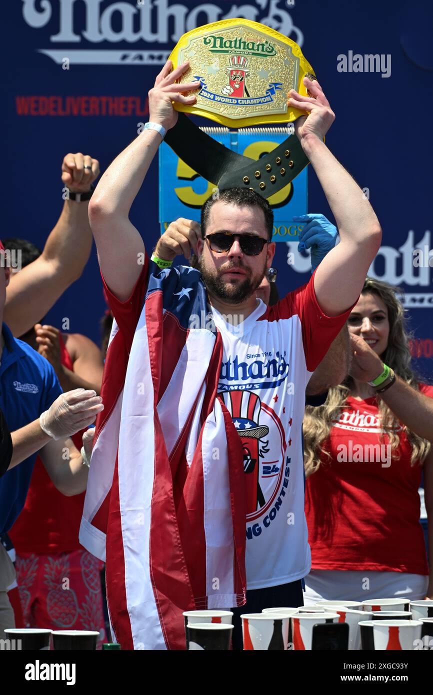 Professional competitive eater Patrick Bertoletti consumes 58 hot dogs ...