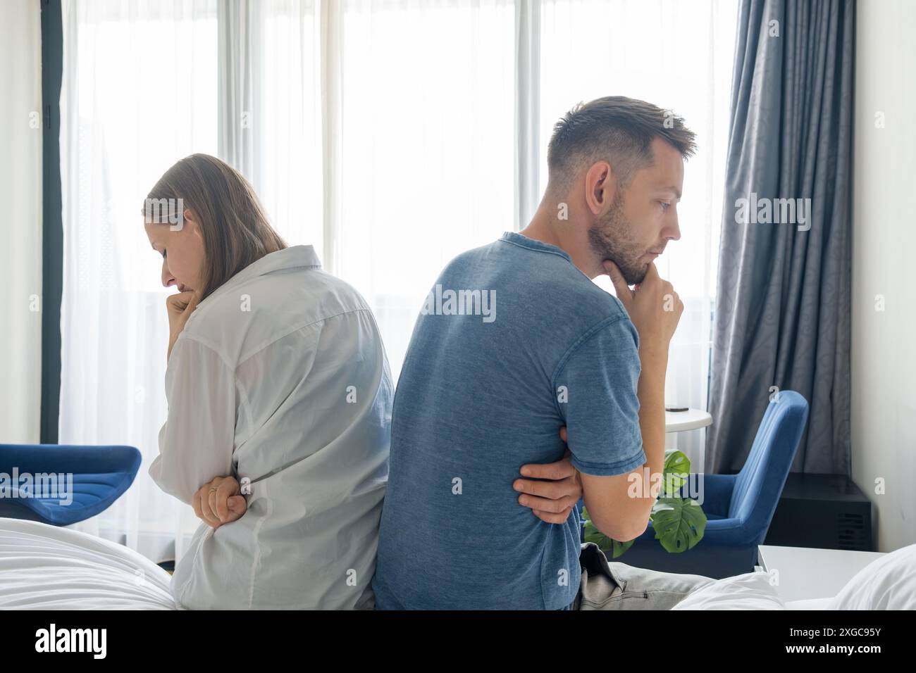 Back view of unhappy couple in argument with disappointed woman and sad ...