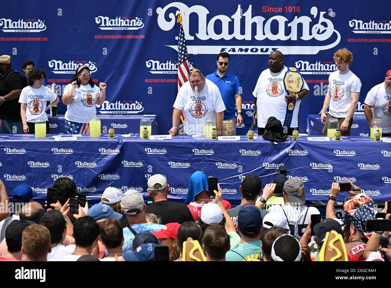 A participant throws up after competing in a Lemonade drinking contest ...