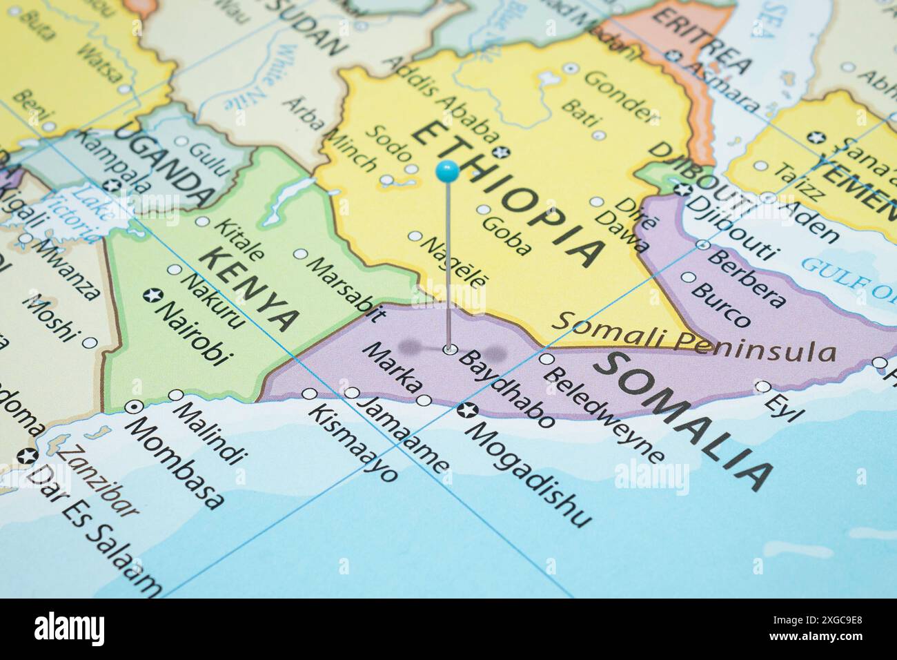 Close up to a Baydhabo city with a Light Blue pin needle into Somalia ...