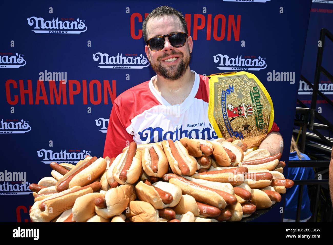 Professional competitive eater Patrick Bertoletti consumes 58 hot dogs ...