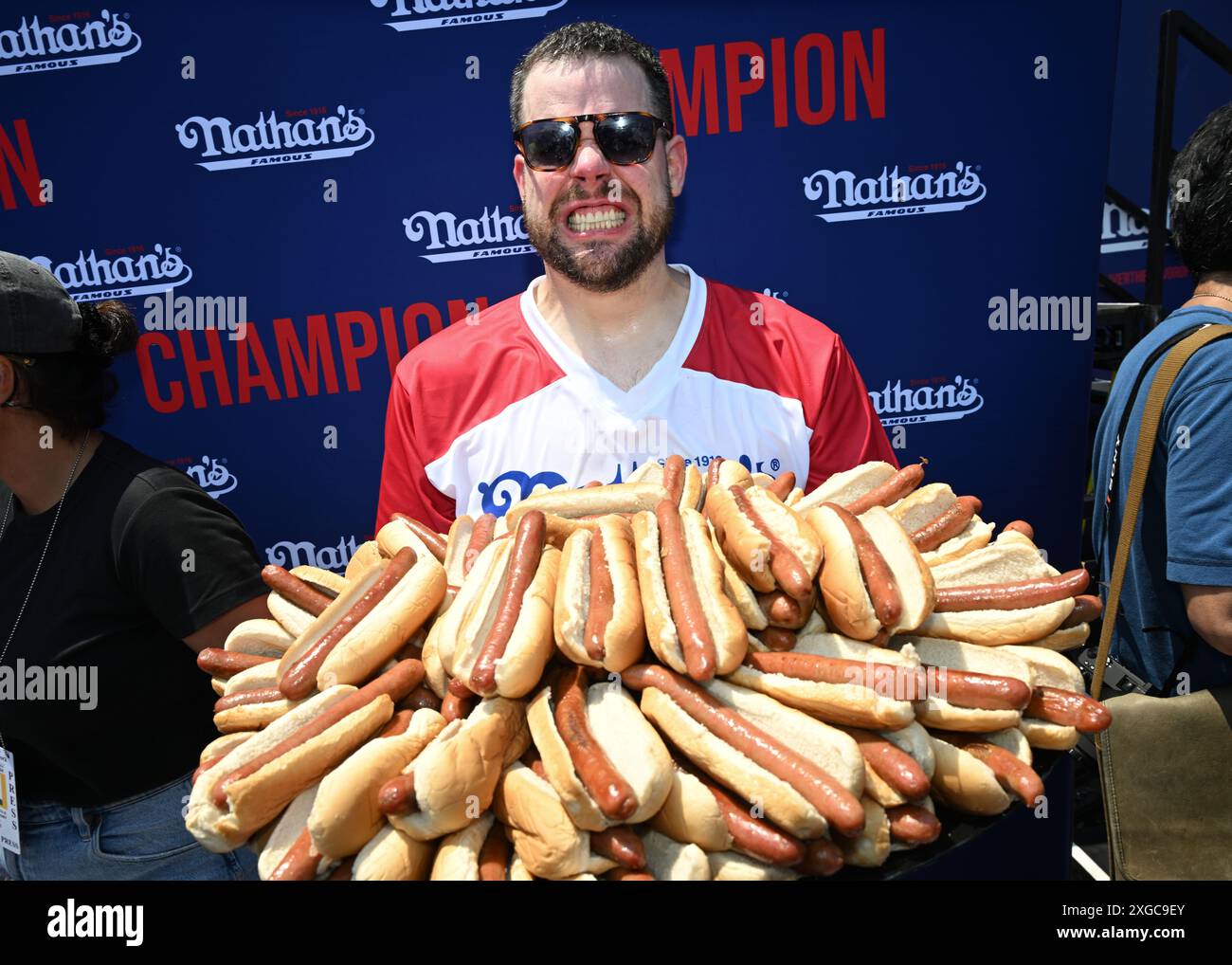 Professional competitive eater Patrick Bertoletti consumes 58 hot dogs ...