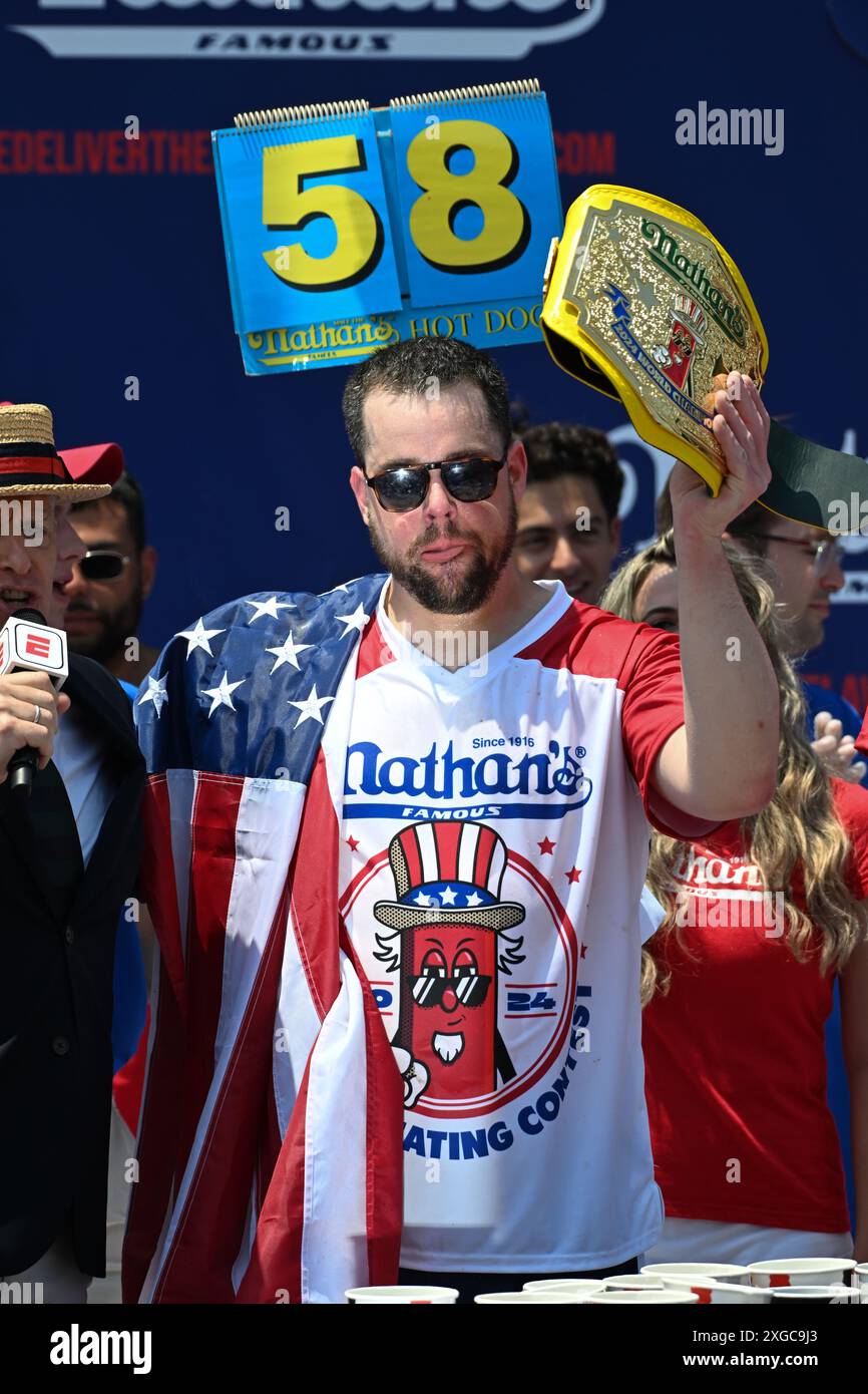 Professional competitive eater Patrick Bertoletti consumes 58 hot dogs ...
