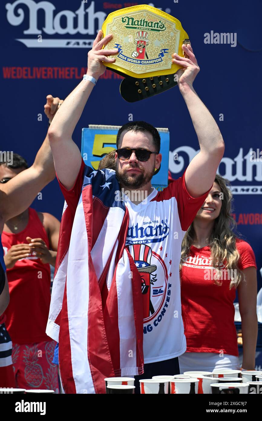 Professional competitive eater Patrick Bertoletti consumes 58 hot dogs ...