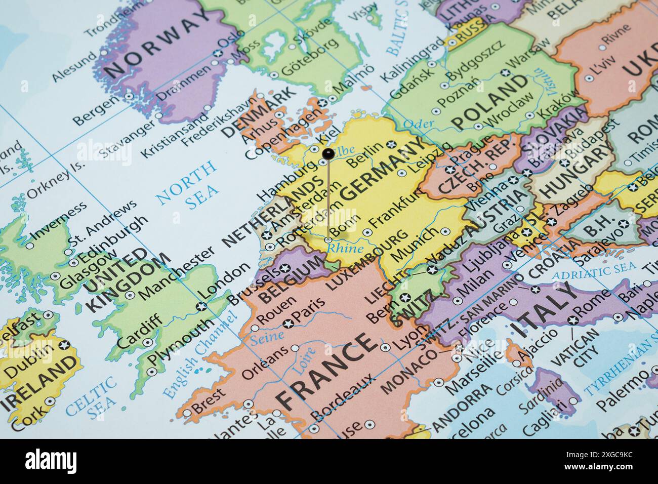 Close up to a Bonn city with a black pin needle into Germany country ...