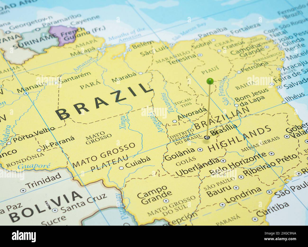 Close up to a Brasilia city with a green pin needle into Brazil country ...