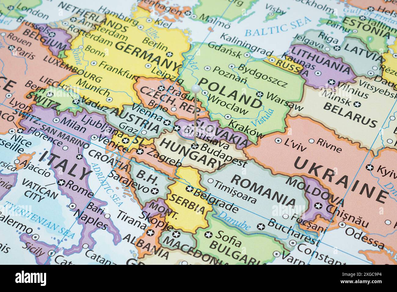 Close up to a Budapest city with a white pin needle into Hungary ...