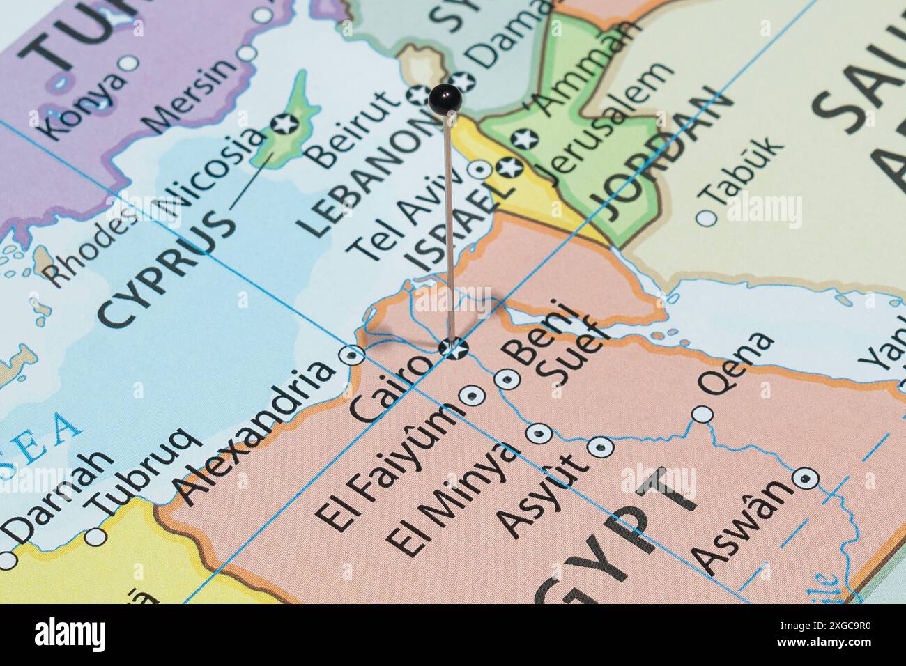 Close up to a Cairo city with a black pin needle into Egypt country ...