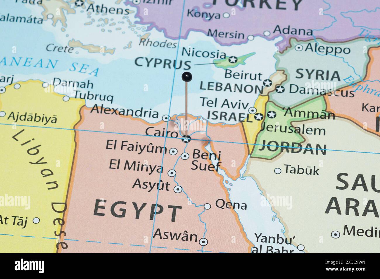 Macro photo of Cairo city with a black pin needle into Egypt country ...