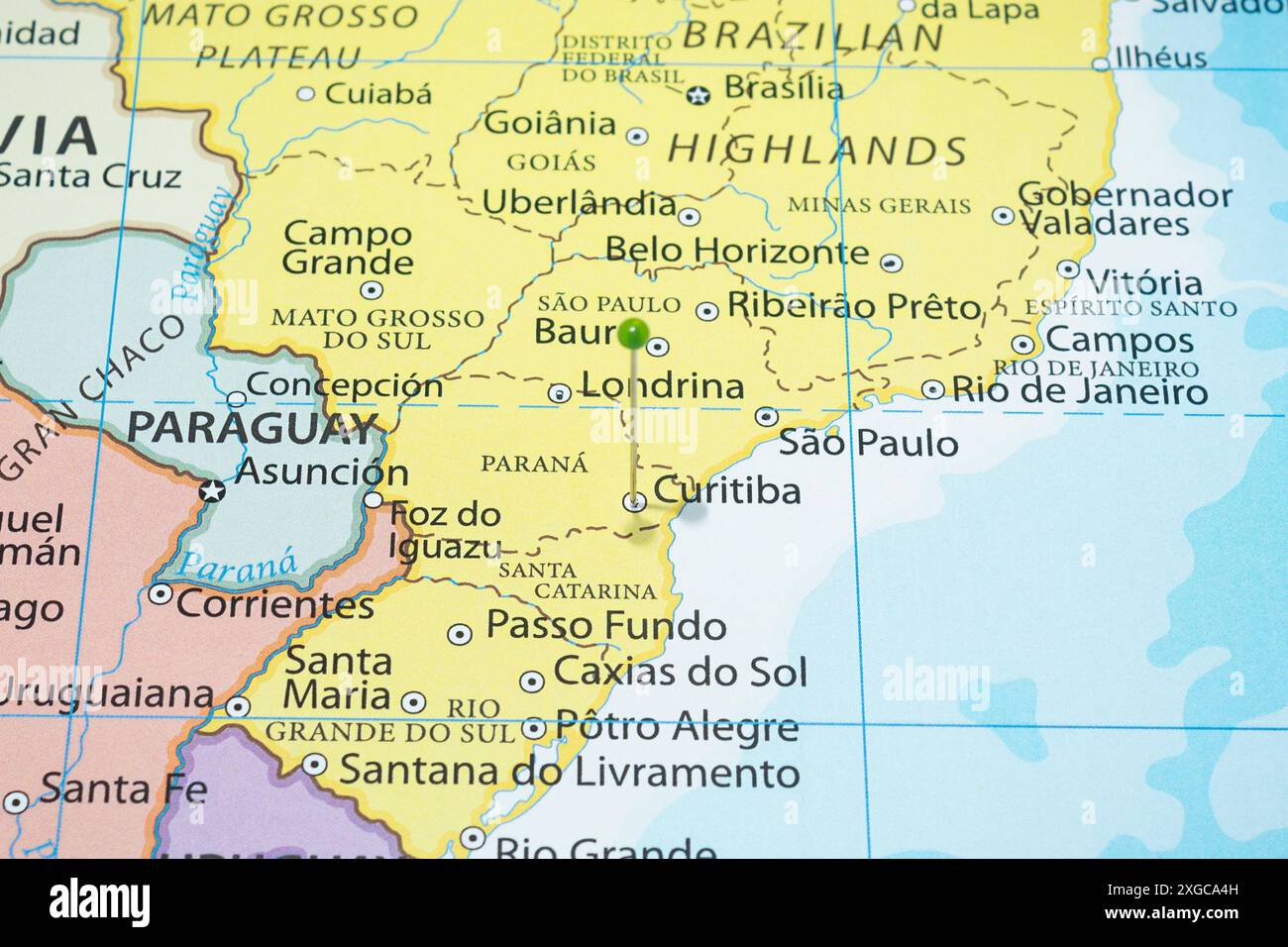 Close up to a Curitiba city with a green pin needle into Brazil country ...