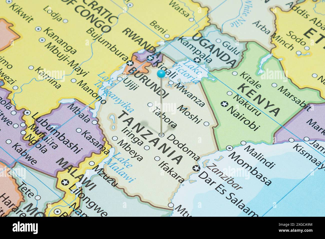 Close up to a Dodoma city with a light Blue pin needle into Tanzania ...