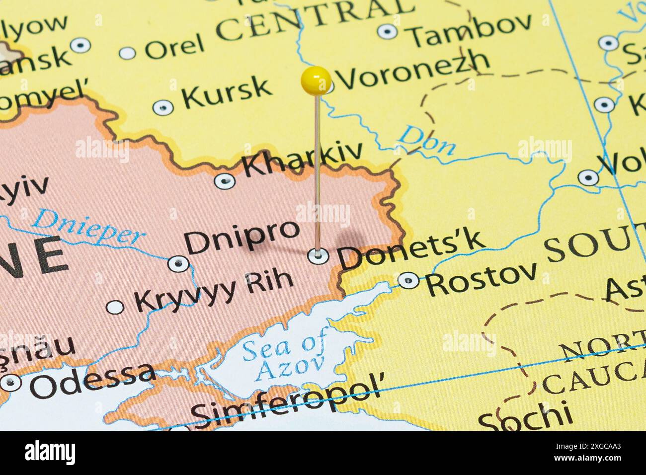 Close up to a Donetsk city with a yellow pin needle into Ukraine ...