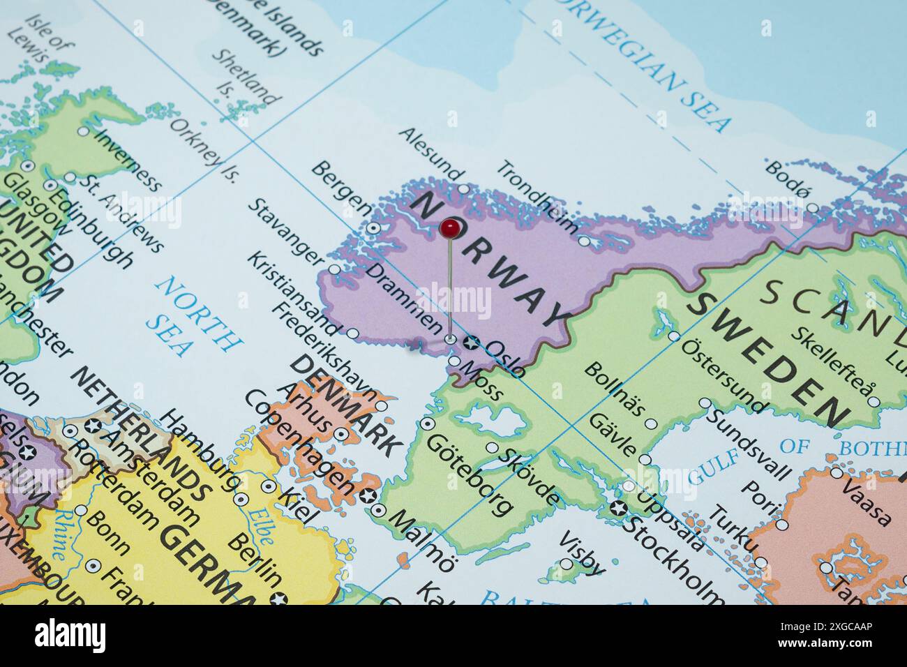 Close up to a Drammen city with a red pin needle into Norway country ...