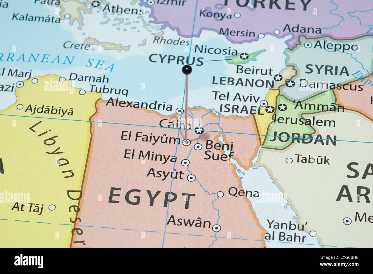 Close up to a El Faiyum city with a black pin needle into Egypt country ...