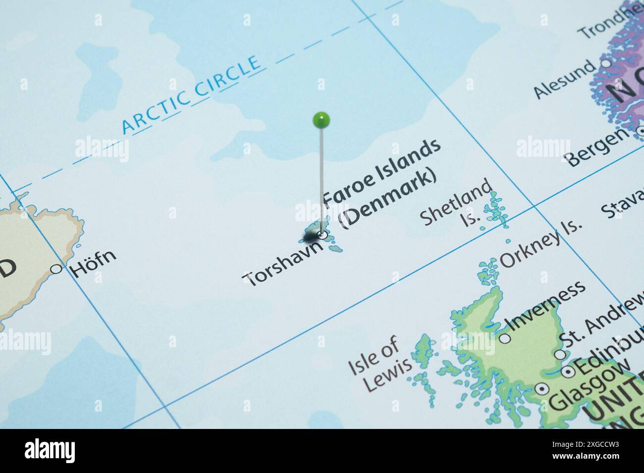 Close up to a Torshavn city with a green pin needle into Faroe Islands ...
