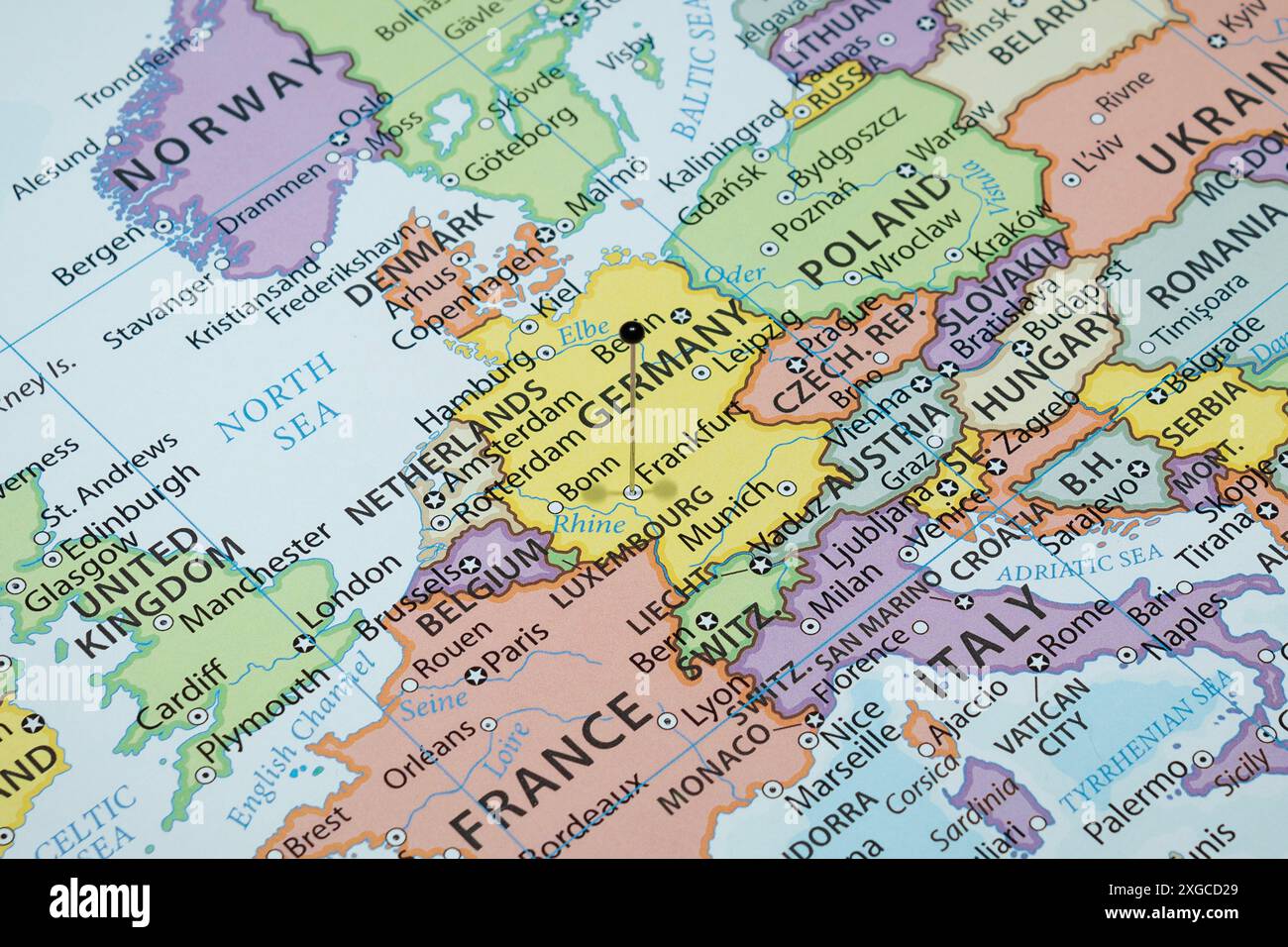 Close up to a Frankfurt city with a black pin needle into Germany ...