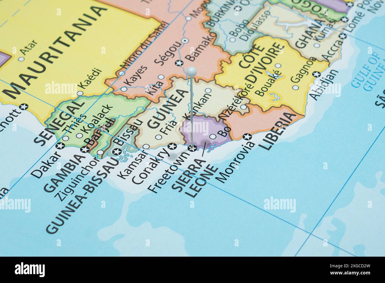 Close up to a Freetown city with a white pin needle into Sierra Leone ...