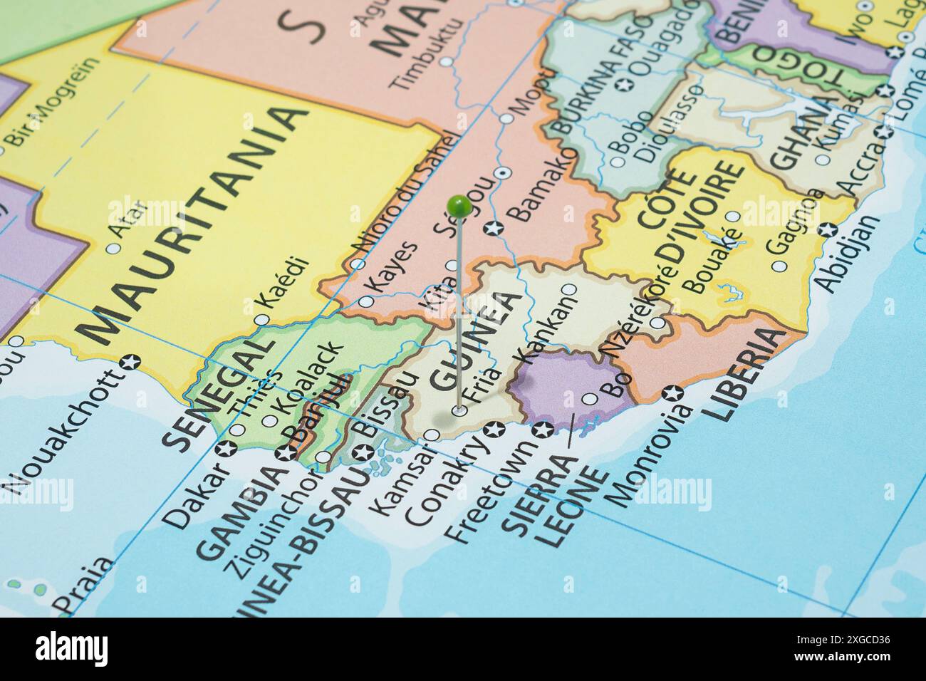 Close up to a Fria city with a green pin needle into Guinea country ...