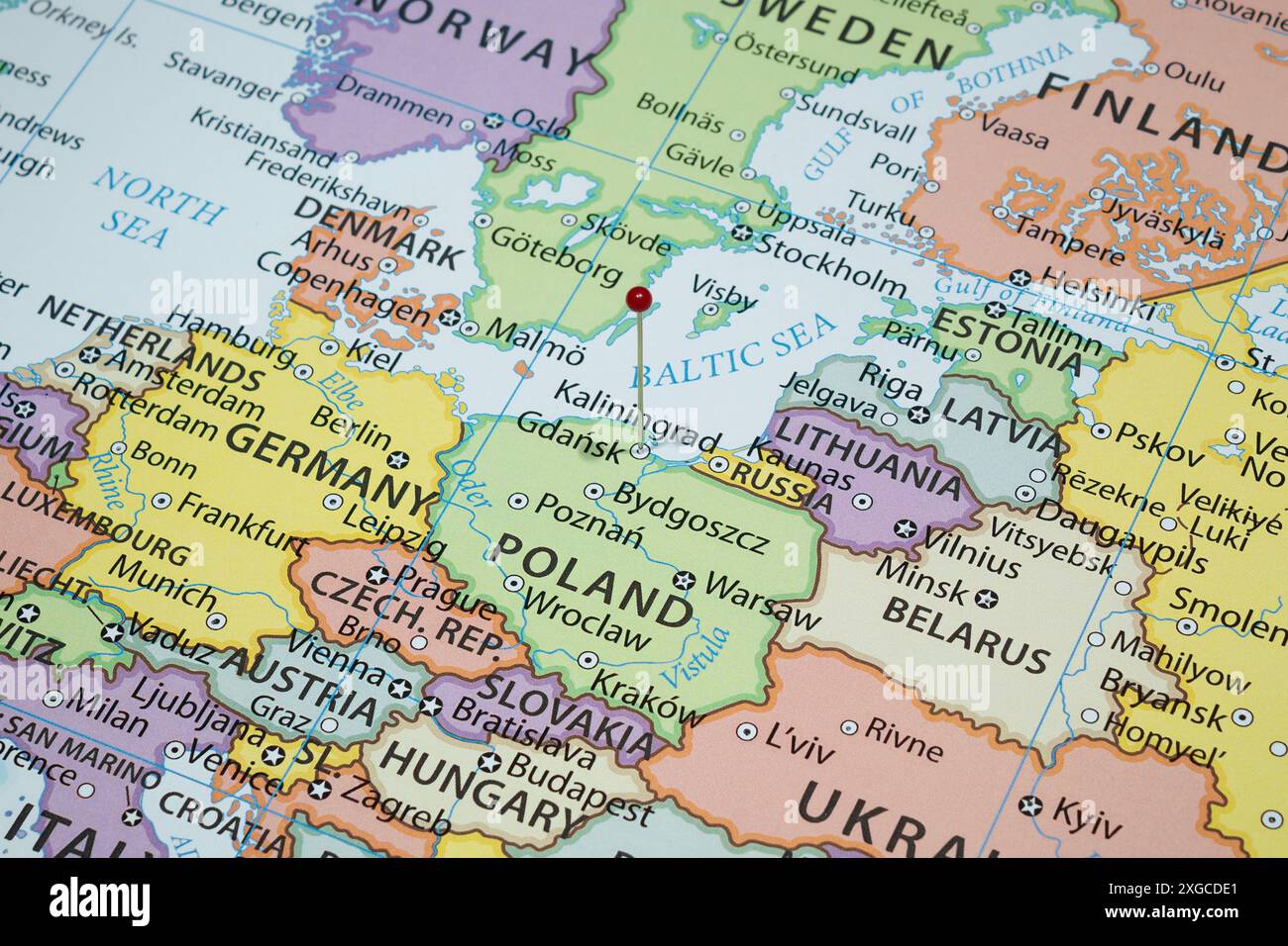 Close up to a Gdansk city with a red pin needle into Poland country ...
