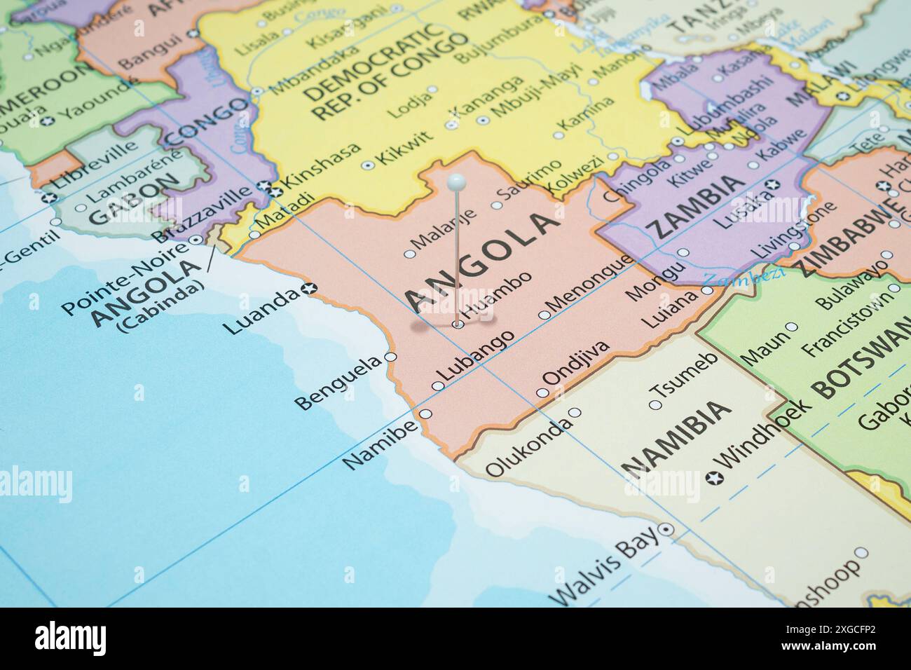 Close up to a Huambo city with a white pin needle into Angola country ...