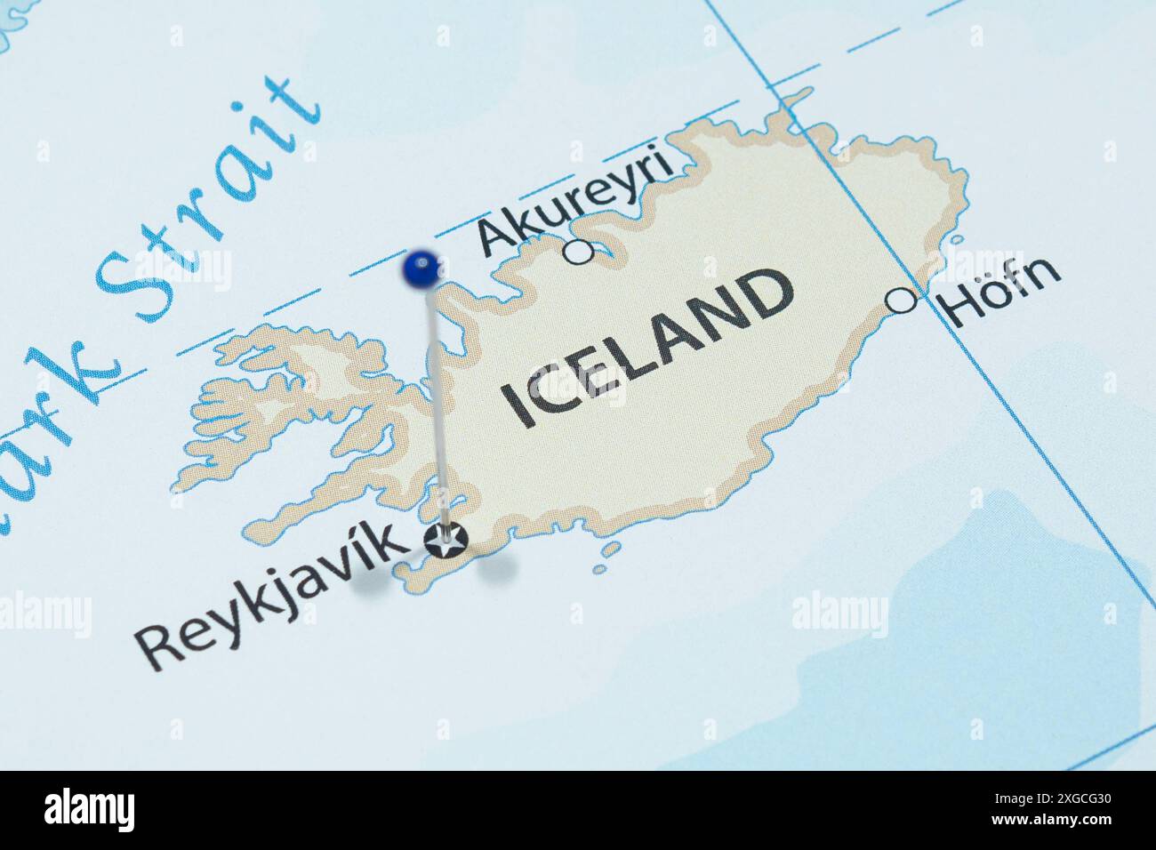 Close up to a Reykjavik city with a blue pin needle into Iceland ...