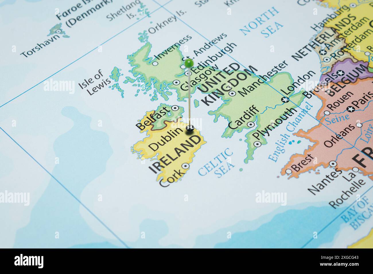 Close up to a Dublin city with a green pin needle into Ireland country ...