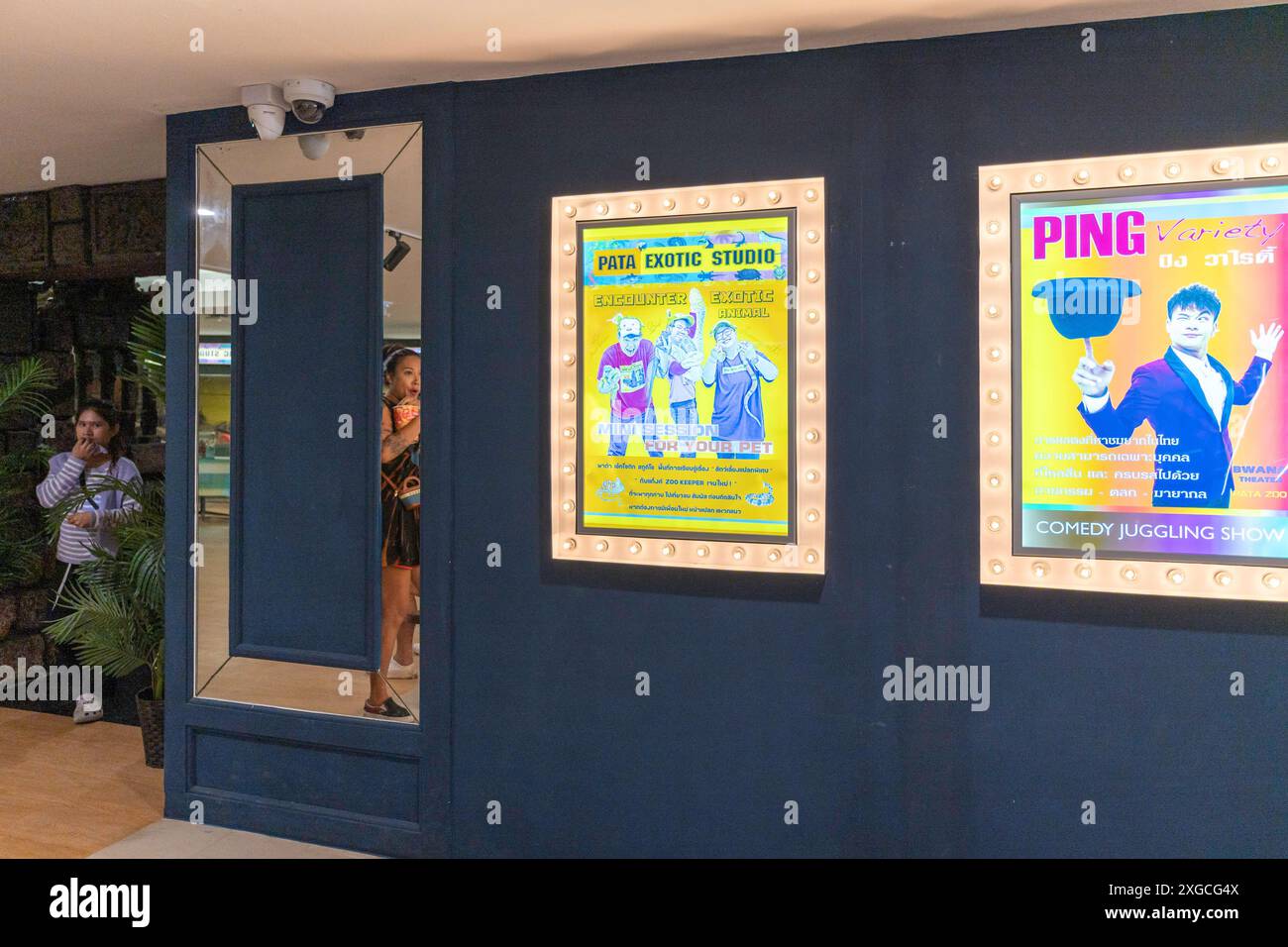 An advertisement is seen displayed on the wall for an exotic show with ...