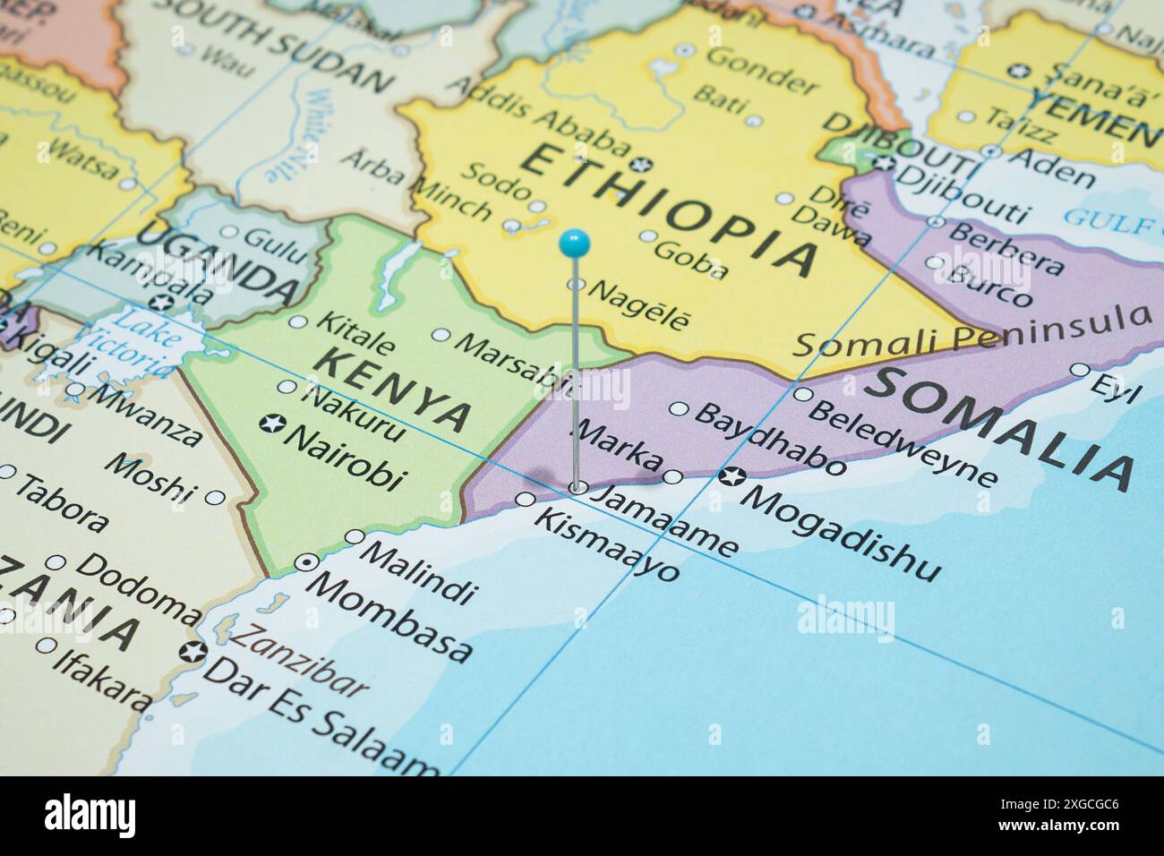 Close up to a Jamaame with a light blue pin needle into Somalia country ...