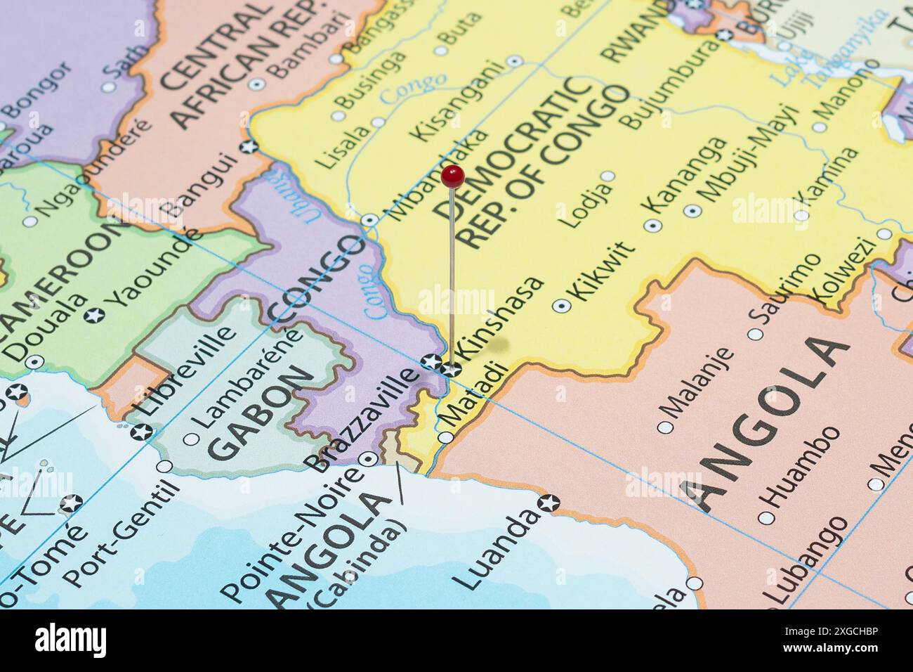 Close up to a Kinshasa city with a red pin needle into Democratic ...