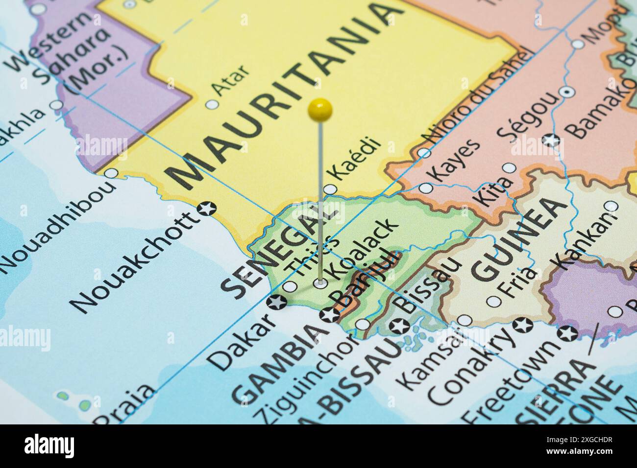 Close up to a Koalack city with a yellow pin needle into Senegal ...