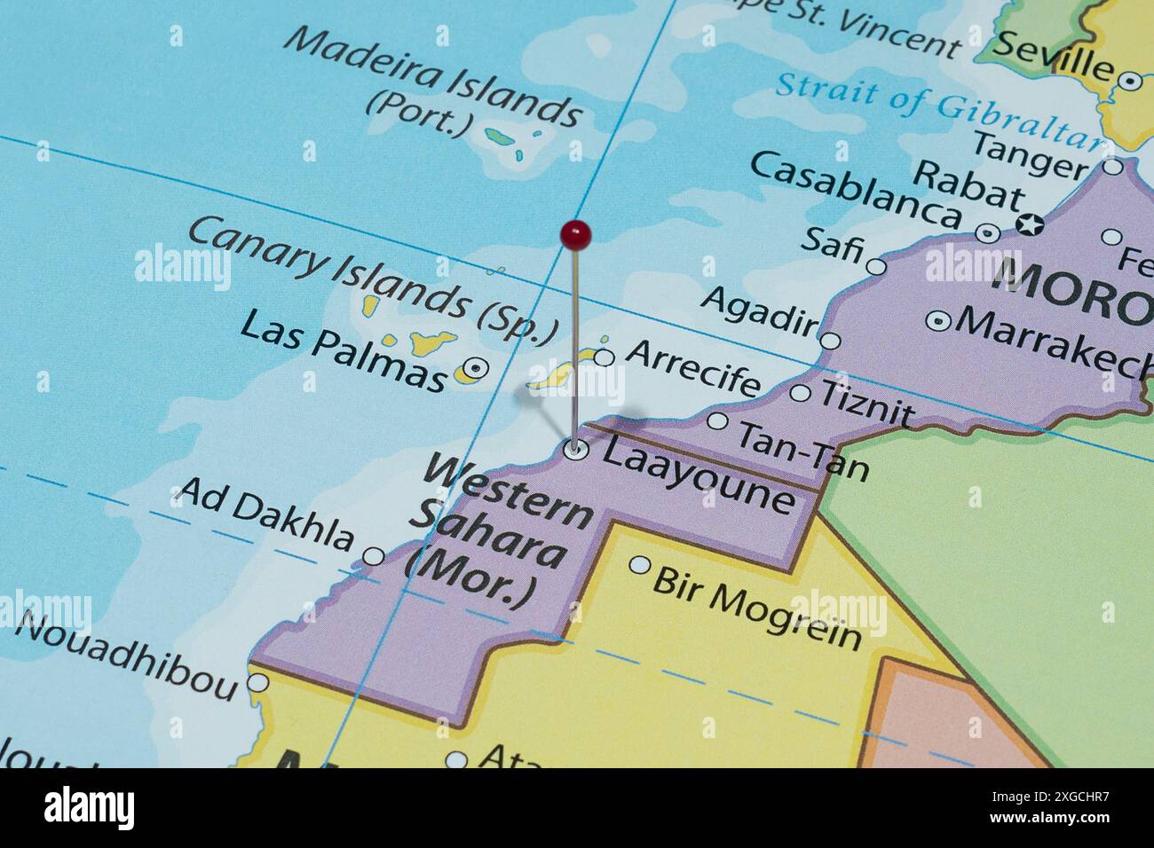 Close up to a Laayoune city with a red pin needle into Western Sahara ...