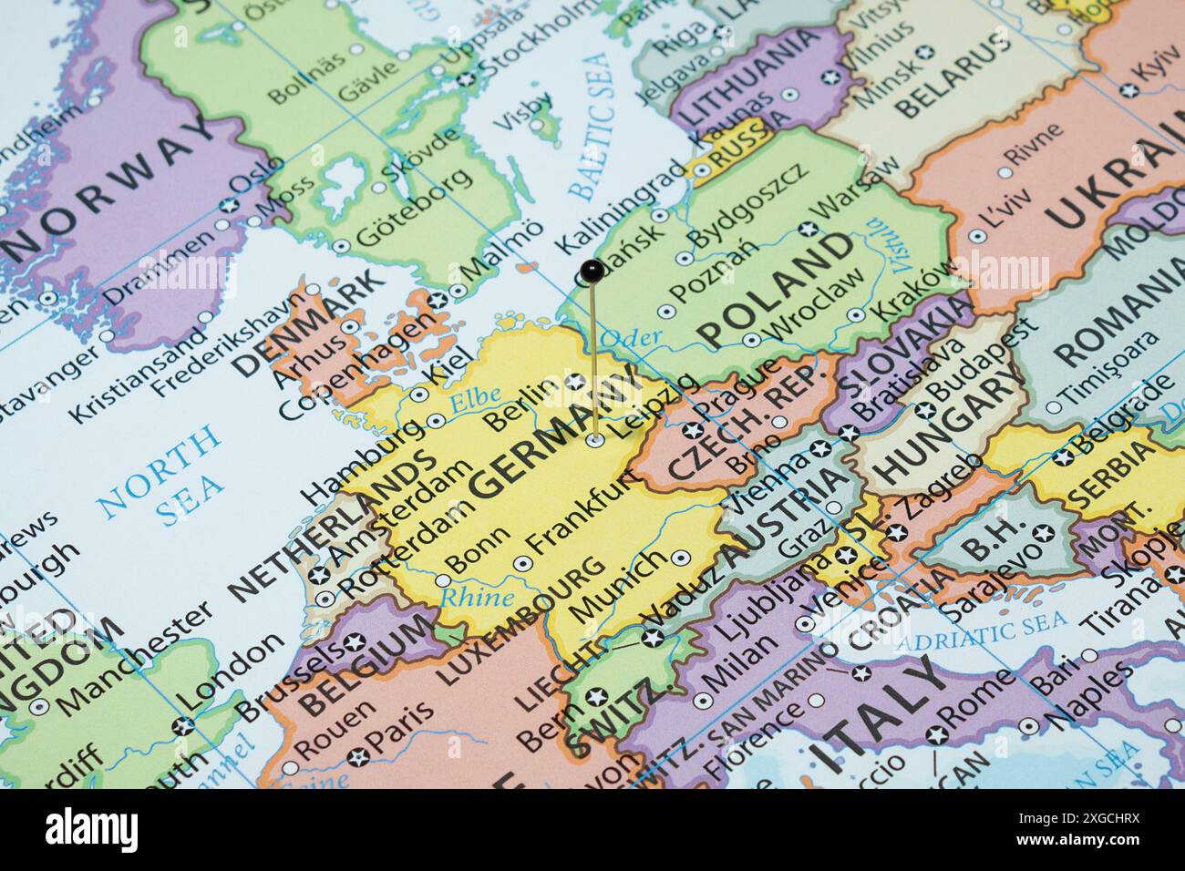 Close up to a Leipzig city with a black pin needle into Germany country ...