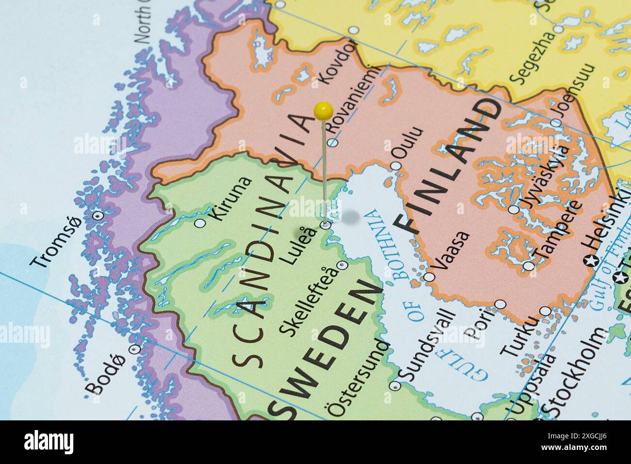 Close up to a Lulea city with a yellow pin needle into Sweden country ...