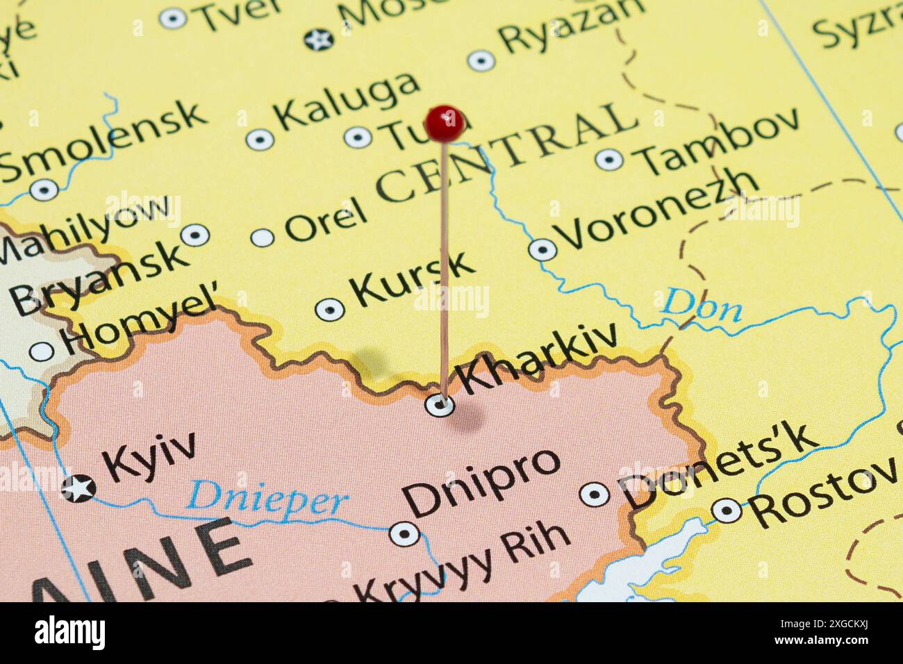 Close up to a Kharkiv city with a red pin needle into Ukraine country ...