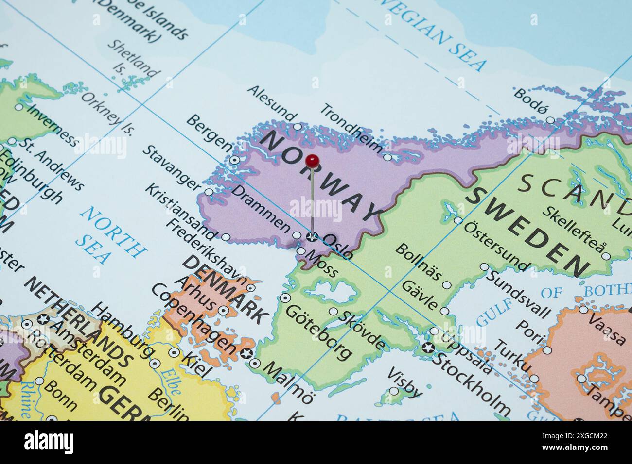 Macro Photo of Oslo city with a red pin needle into Norway country ...