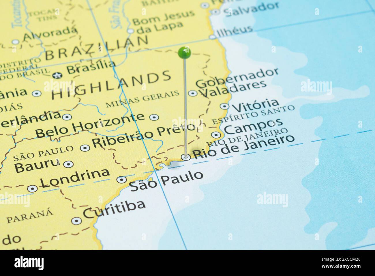 Close up to a Rio de Janeiro city with a green pin needle into Brazil ...