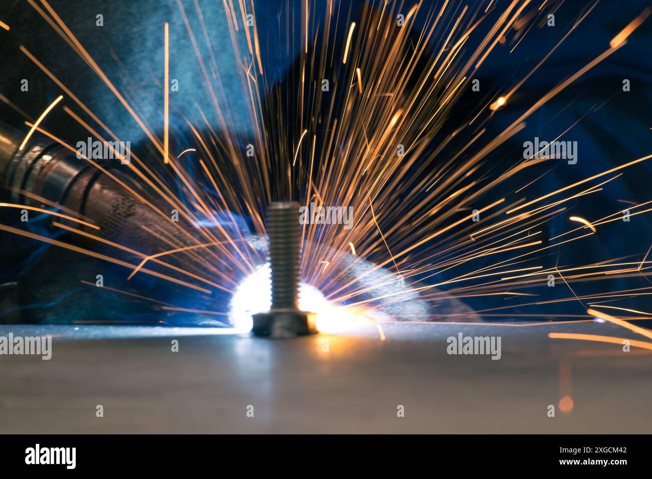 Detail of heavy industry manufacturing, sparks come out of a metal ...