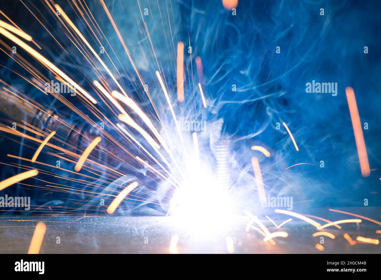 Detail of heavy industry manufacturing, sparks come out of a metal ...