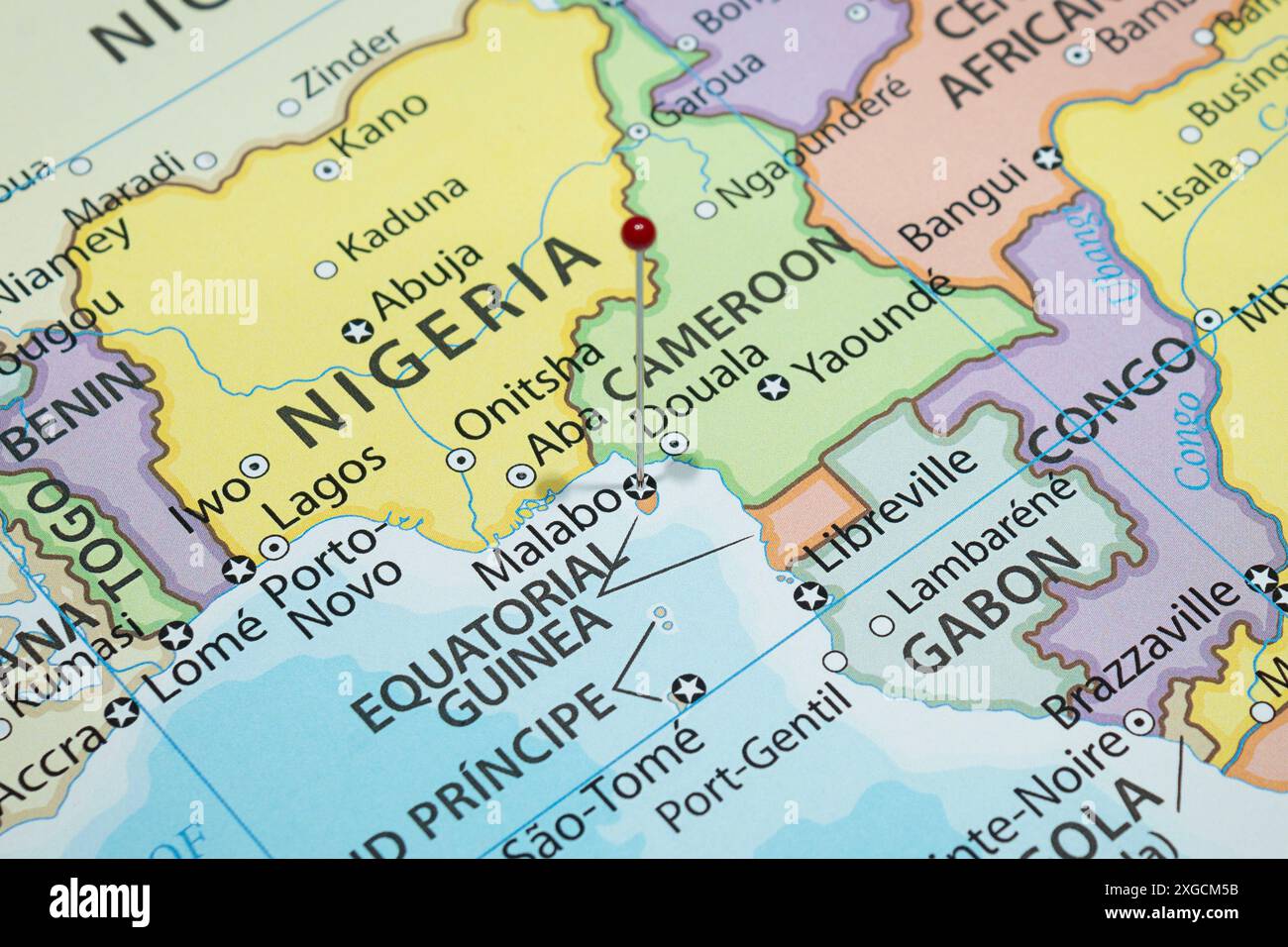 Close up to a Malabo city with a red pin needle into Equatorial Guinea ...