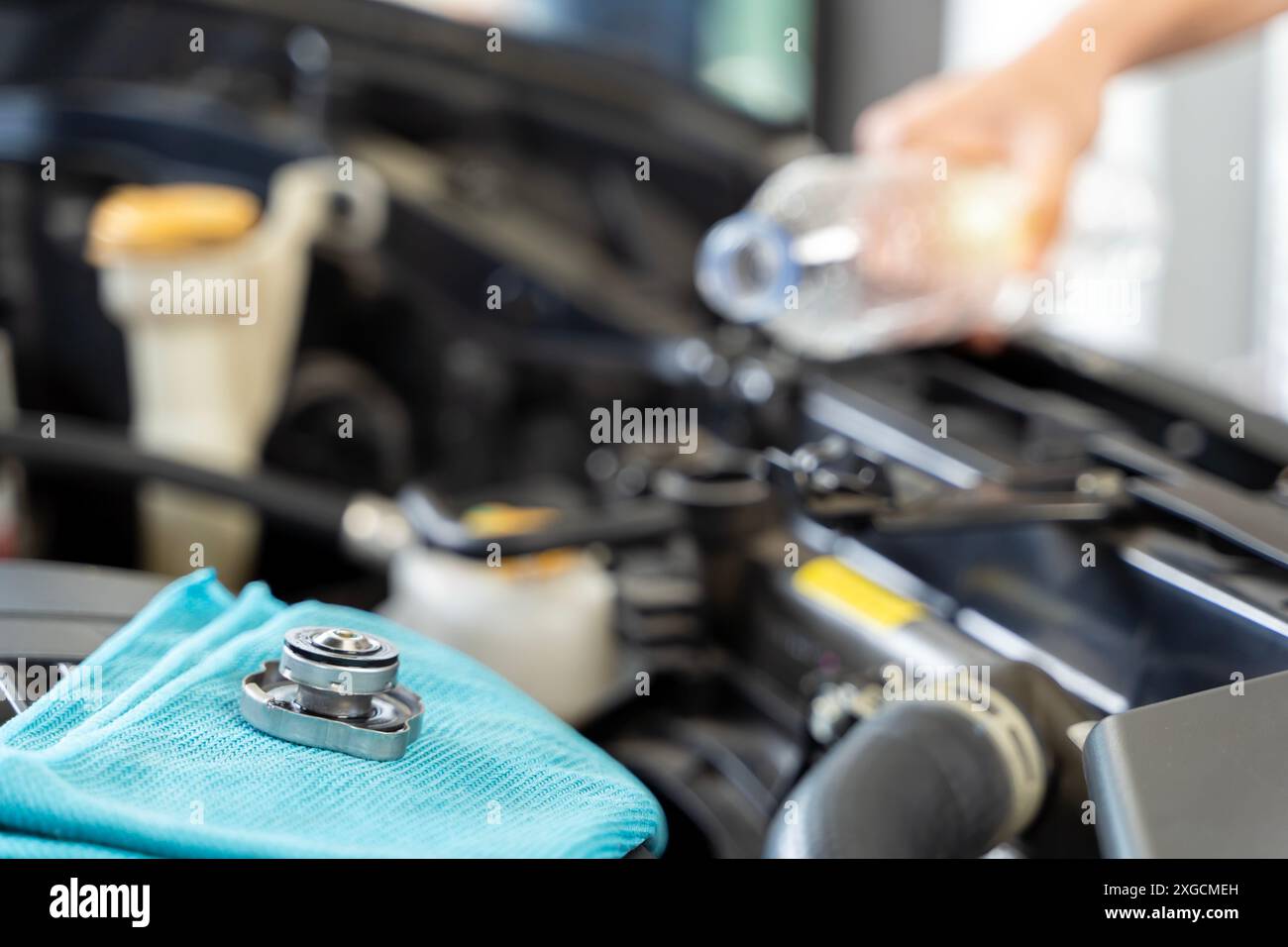 A woman takes matters into her own hands radiator refill. Mechanic ...