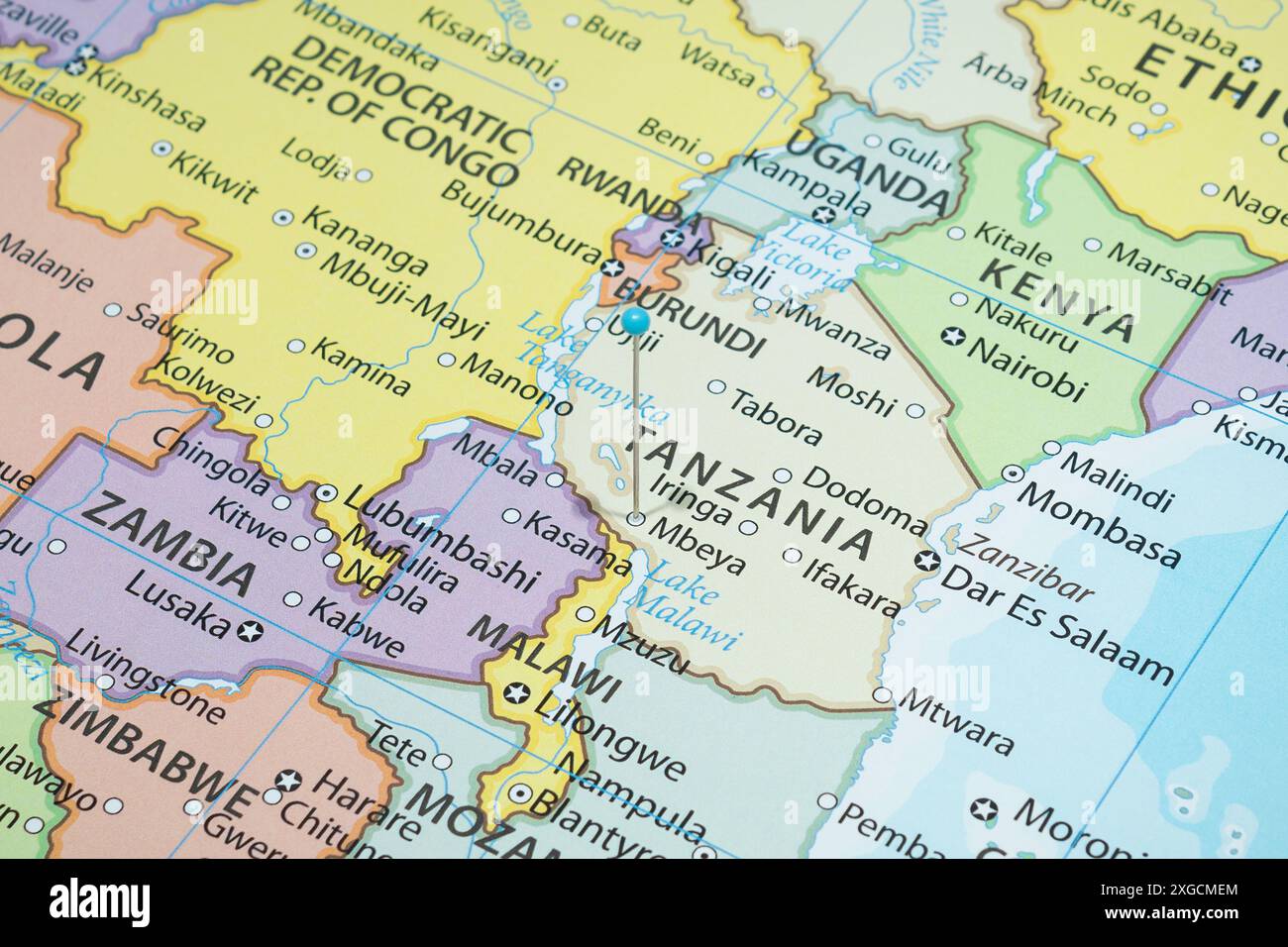 Close up to a Mbeya city with a light blue pin needle into Tanzania ...